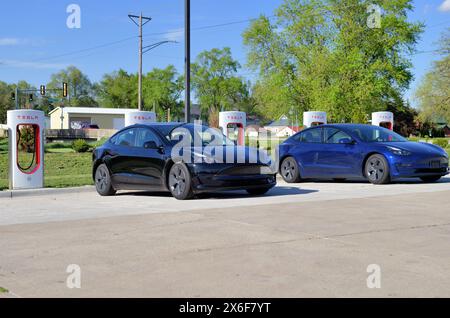 Rochelle, Illinois, USA. Tesla being recharged at a Tesla electric ...