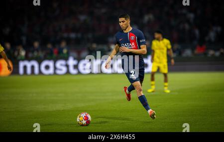 Achraf Hakimi of Paris Saint-Germain kisses the trophy after the Paris ...