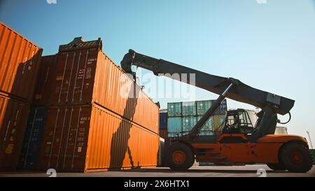 Modern Container Handler Carrying a Large Red Steel Shipping Cargo ...