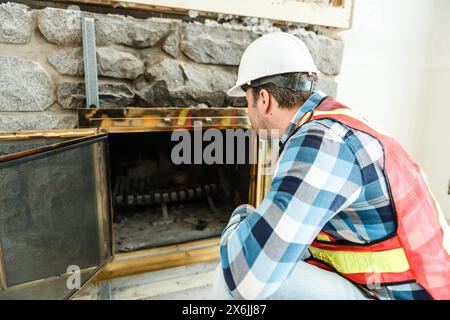 Inspector with white helmet inspecting an old house to be sure ...