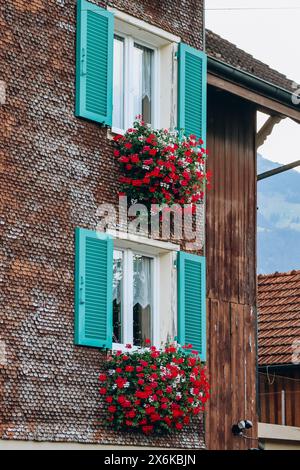 Beautiful facades of the Swiss Alpnachstad Stock Photo - Alamy