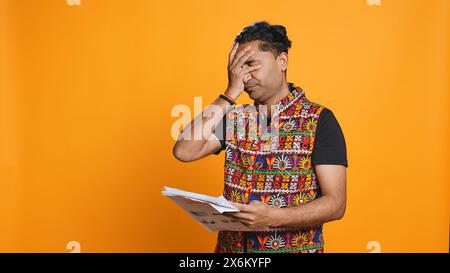 Irked manager looking over company financial profit report audit ...