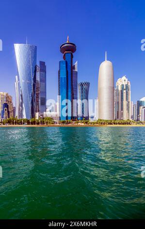 Harbor views with skyscrapers and ships in Doha, capital of Qatar in ...