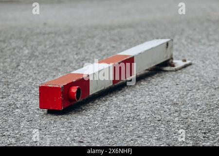 Folding Parking Post, red and white, folded on the ground Stock Photo ...