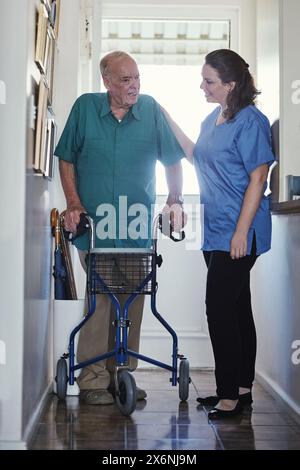 Smiling old man talking with a volunteer Stock Photo - Alamy