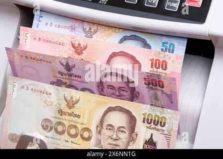 Thai money - baht in a counting machine Stock Photo - Alamy