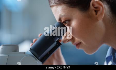 Beautiful female biotechnology scientist chemist working in lab Stock ...