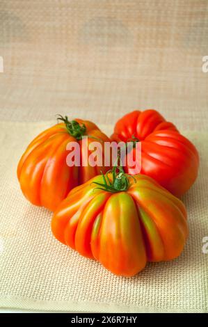 Three raf tomatoes. Close view Stock Photo - Alamy