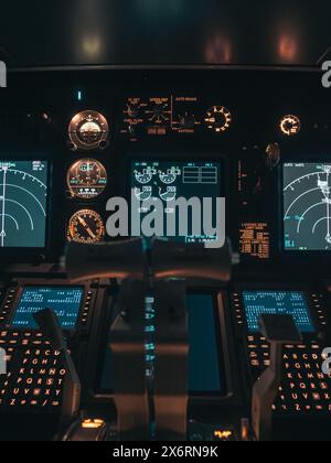 Cockpit view of an airplane during a night-time flight with illuminated ...