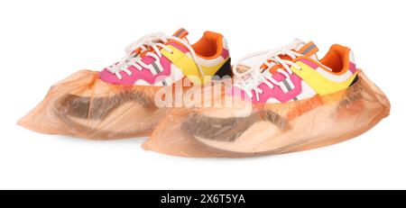 Sneakers in shoe covers isolated on white Stock Photo - Alamy