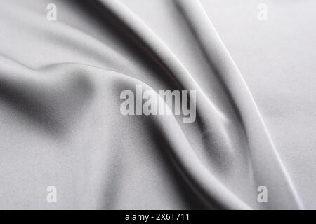 Texture of beautiful light grey silk fabric as background, closeup ...