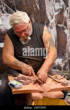 Pipestone, Minnesota - A Native American makes pipes from pipestone at ...