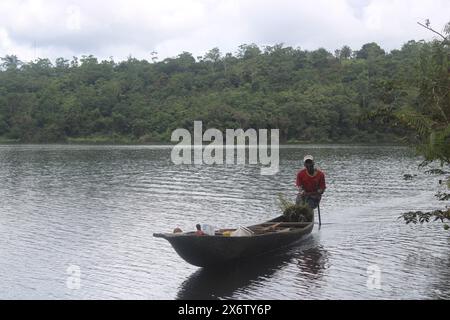 Dizangue, Cameroon. September 23, 2023. A fisherman among canoes on the ...