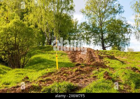 Dug up earth in a picturesque area after laying a gas pipeline ...