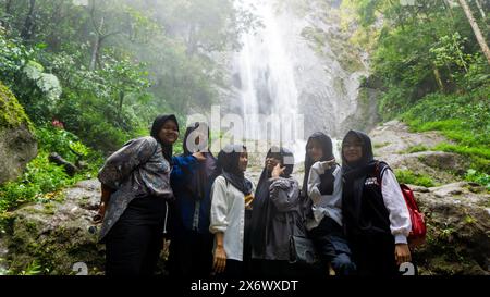 People vacation at dolo waterfall. Dolo is one of the waterfalls in ...