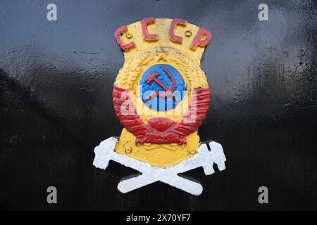 Detail of an old Soviet crest, symbol, medallion with hammer and wrench ...