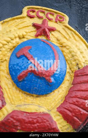 Detail of an old Soviet crest, symbol, medallion with hammer and wrench ...