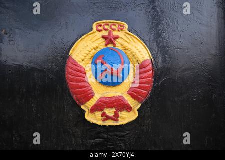 Detail of an old Soviet crest, symbol, medallion with hammer and wrench ...