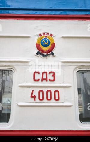 Detail of an old Soviet crest, symbol, medallion with hammer and wrench ...