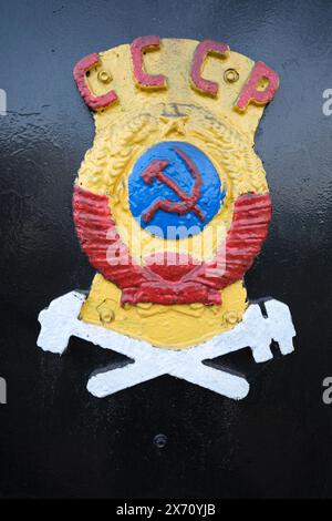 Detail of an old Soviet crest, symbol, medallion with hammer and wrench ...
