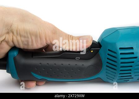 Angle grinder switch trigger with a safety lock Stock Photo - Alamy