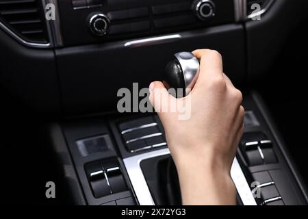 Woman using gear stick while driving her car, closeup Stock Photo - Alamy