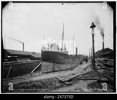 Cargo vessel in dry dock on ship repairing yard. Variable pitch ...