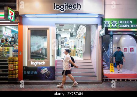 A pedestrian walks past the Swiss electronics company Logitech store in ...
