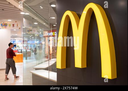 A man walks past an American fast food restaurant Burger King. (Photo ...