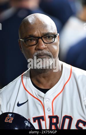 Houston Astros first base coach Dave Clark catches a football during ...