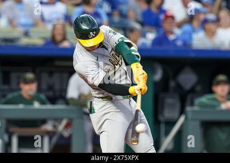 Athletics designated hitter Brent Rooker follows through during an at ...