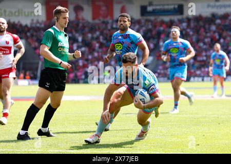 Wigan Warriors' Abbas Miski scores his side's first try of the game ...