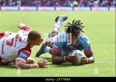 Wigan Warriors' Junior Nsemba scores his sides third try during the ...