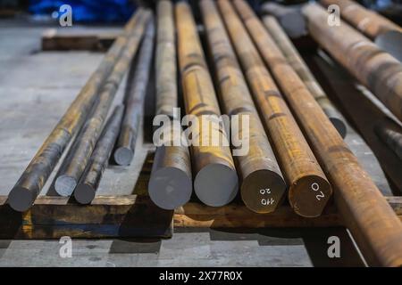 Round long metal billets at a steel mill Stock Photo - Alamy