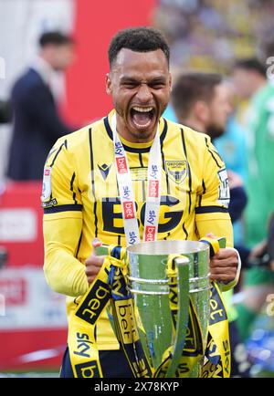 Oxford United's Josh Murphy with the trophy after the Sky Bet League ...