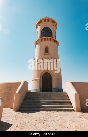 Lighthouse in Sur, Oman with blue sky and white clouds Stock Photo - Alamy