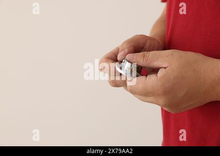 Worker holding screw and pipe fitting for installation, closeup Stock ...