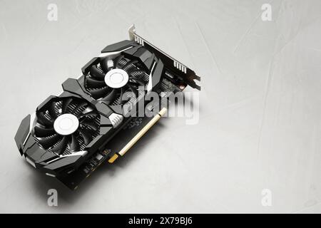 Computer graphics card on gray textured background, top view. Space for ...