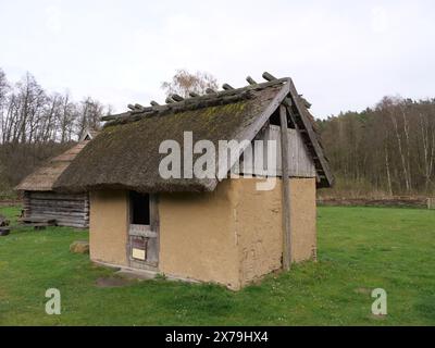 Slavic house covered with thatch in an open-air museum Stock Photo - Alamy