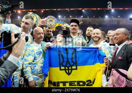 Oleksandr Usyk celebrates with the Undisputed Heavyweight title belt ...