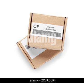 Cardboard packages with shipping labels and barcodes on white ...
