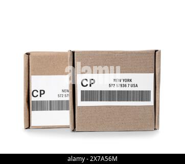 Cardboard packages with shipping labels and barcodes on white ...