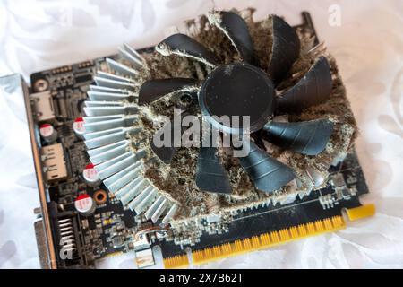 Small video card with very dusty cooler fan Stock Photo - Alamy