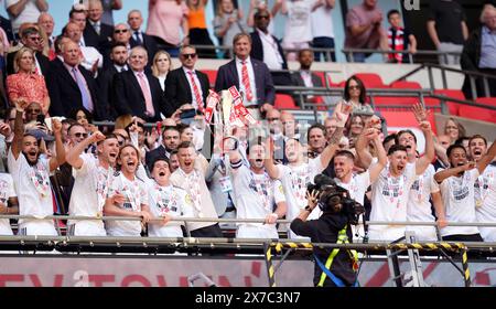 Crawley Town's Dion Conroy lifts the trophy after the Sky Bet League ...