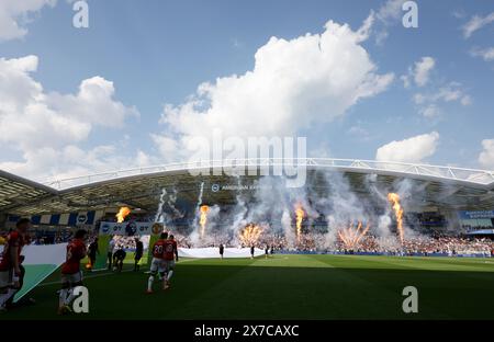 Pyrotechnics are set off as the players walk out onto the pitch ahead ...
