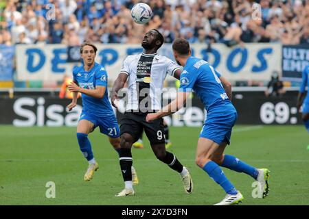 Udinese's Keinan Davis in action hindered by Lazio's Reda Belahyane ...