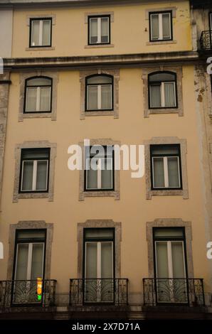 White traditional portuguese building white balconies Stock Photo - Alamy