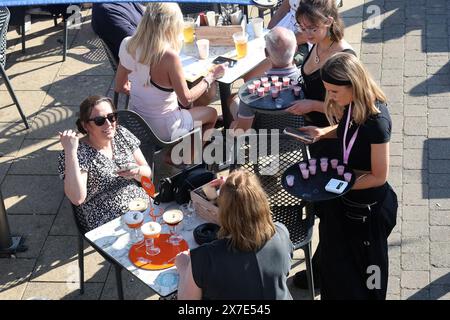 Staff serving Tequila Rose shots at a seafront bar in Brighton Stock ...