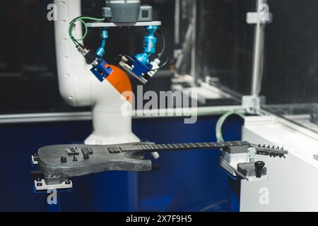 using robot arm to check the guitar paint, controling the quality in ...