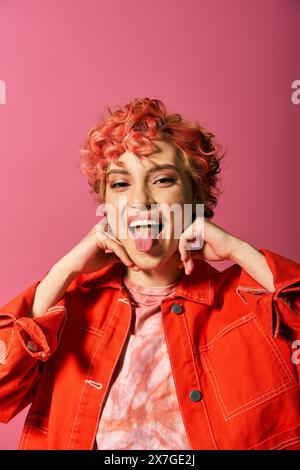 Happy young beautiful woman pulls her hands up, standing on the bed in ...